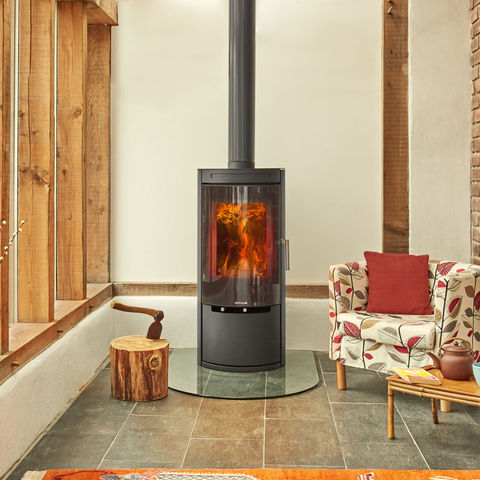 Morso 6143 stove, contemporary design, side windows, with a logstore
